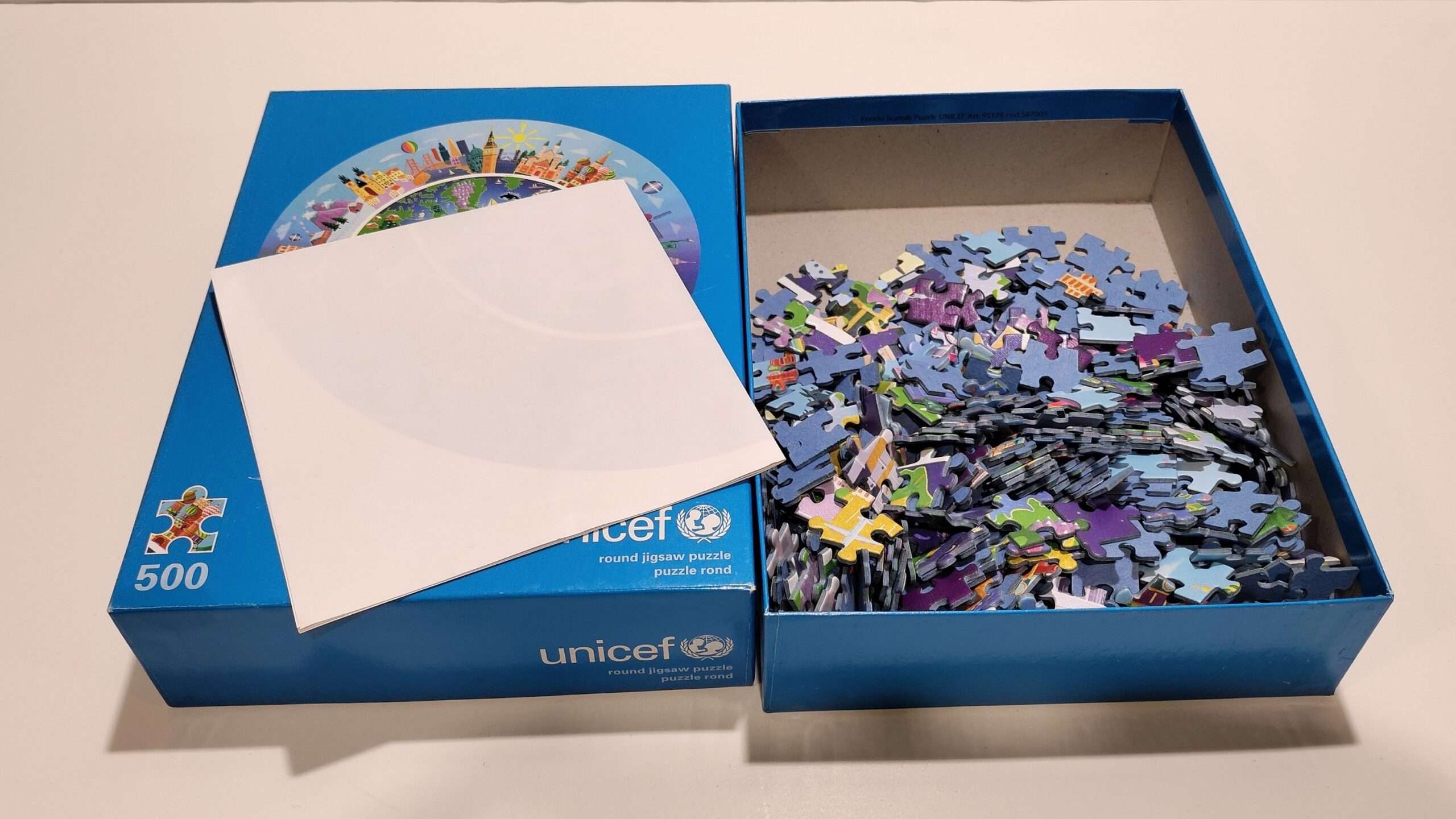 UNICEF round Jigsaw puzzle. 500 brikker. 50 cm i diameter. • Møllers ...